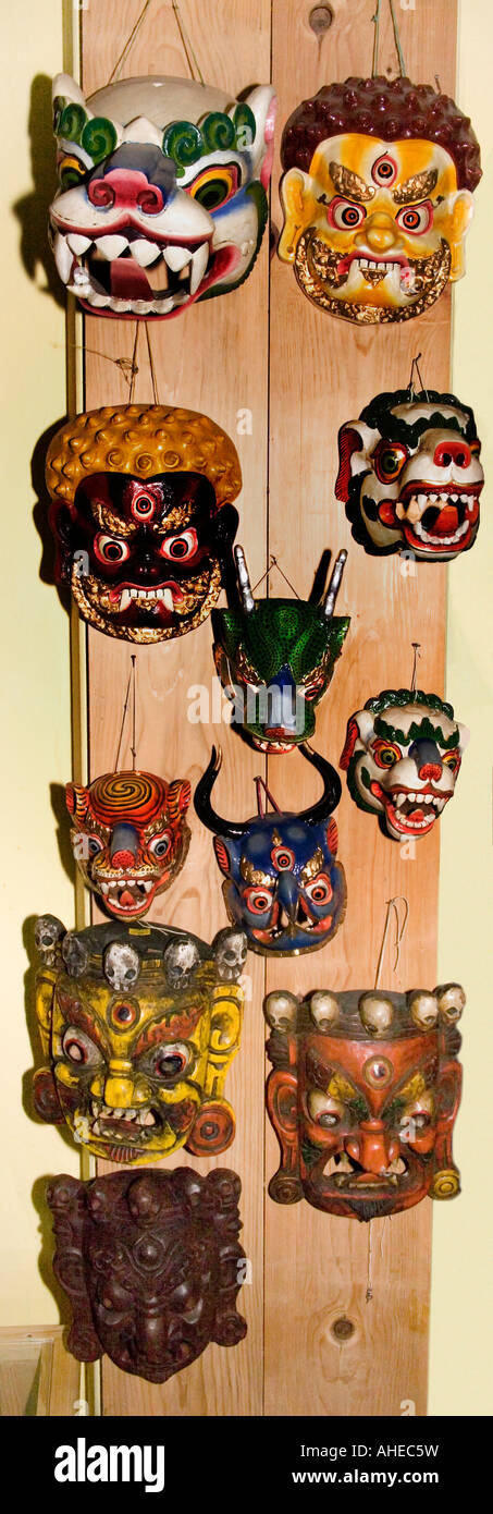 A group of eleven traditional Bhutanese carved and painted wooden masks ...