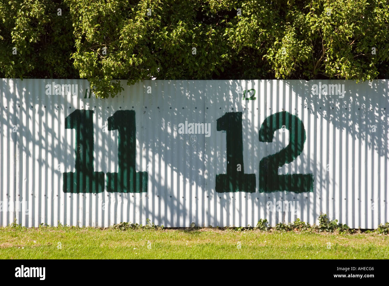 numbers painted on corrugated fence - 1 Stock Photo - Alamy