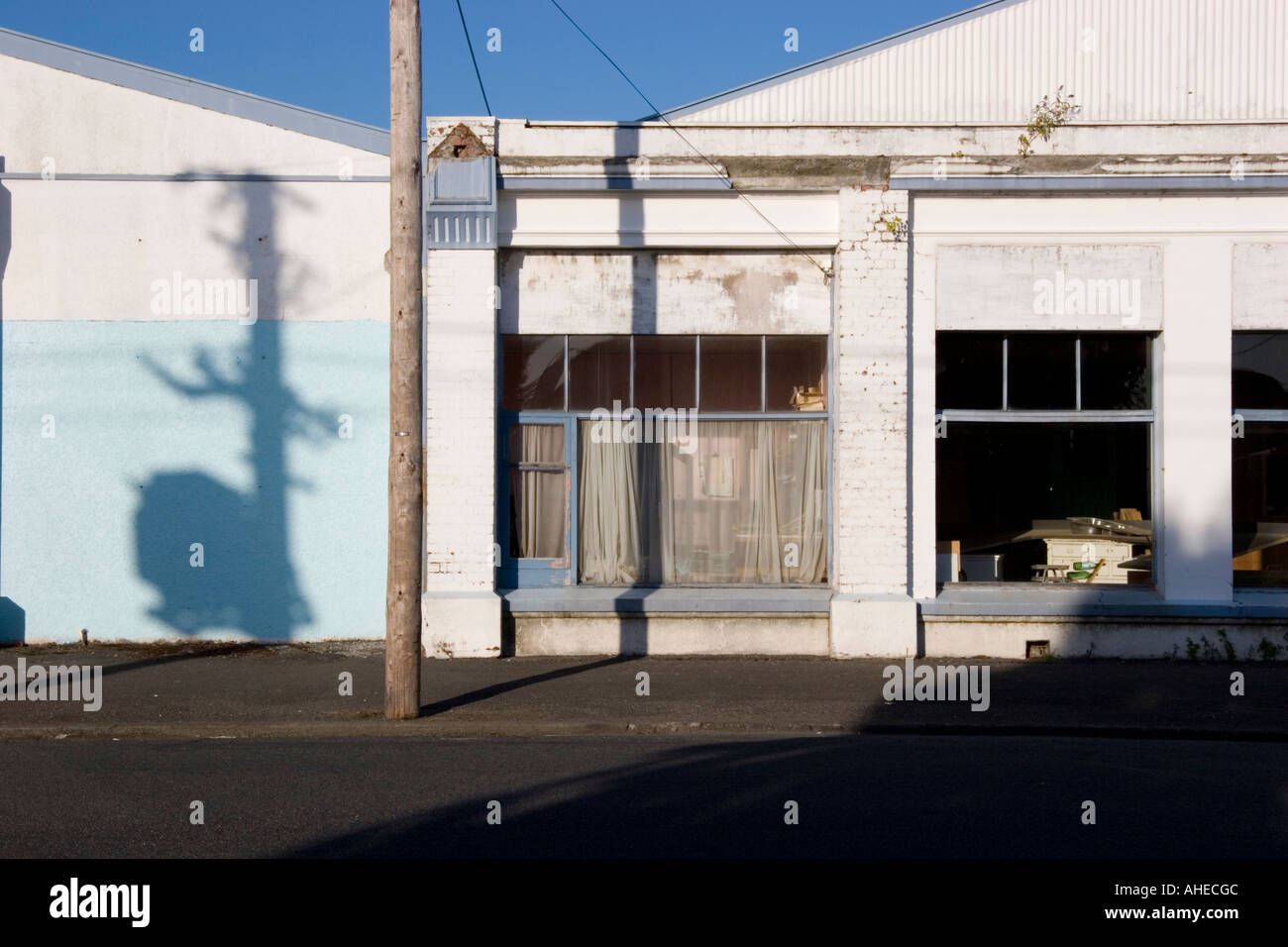 telephone pole and shadow on building front with sindows Stock Photo ...
