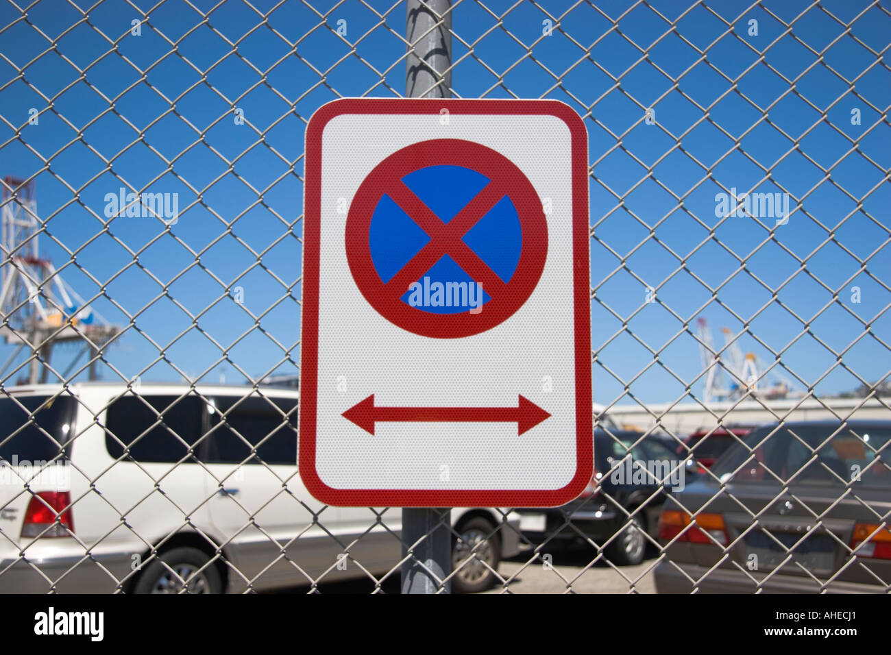 no parking sign on metal fence Stock Photo - Alamy