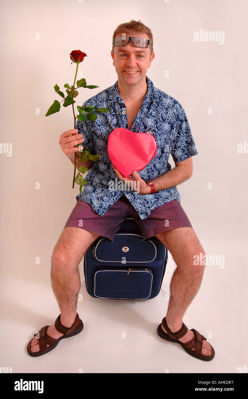 STUDIO PORTRAIT ILLUSTRATING MEN GOING ON HOLIDAY TO FIND LOVE Stock ...