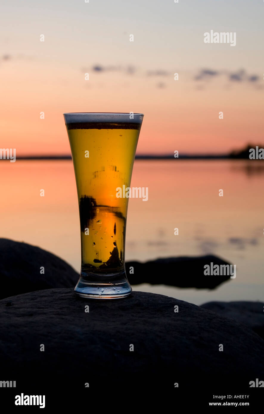 a glass of refreshing beer in sunset scenery Stock Photo - Alamy