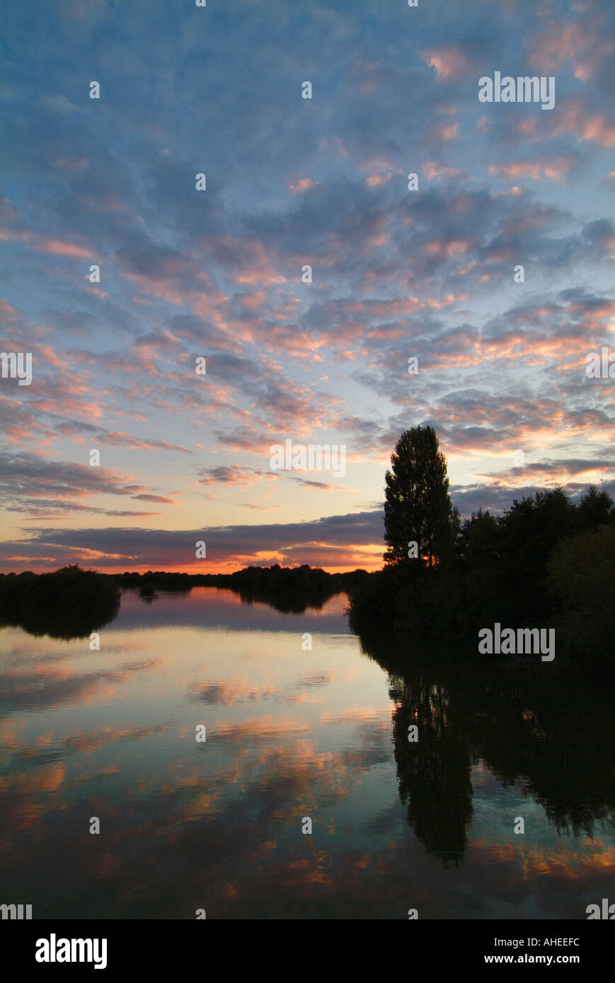 Sunset over flooded reclaimed gravel pits at Attenborough Nature ...