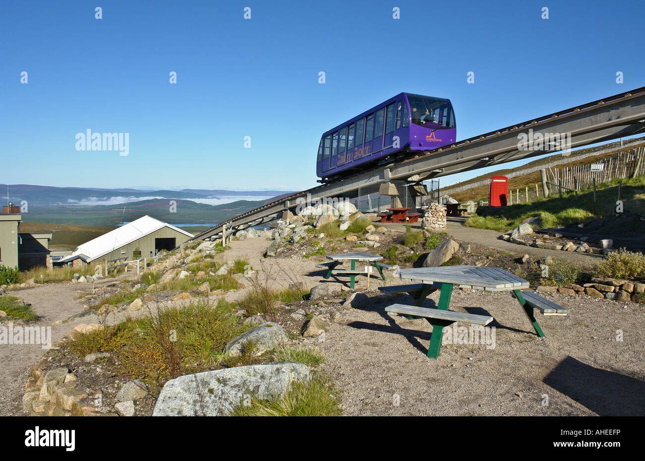 A sunny view of one of the funicular cars progressing towards Cairngorm ...