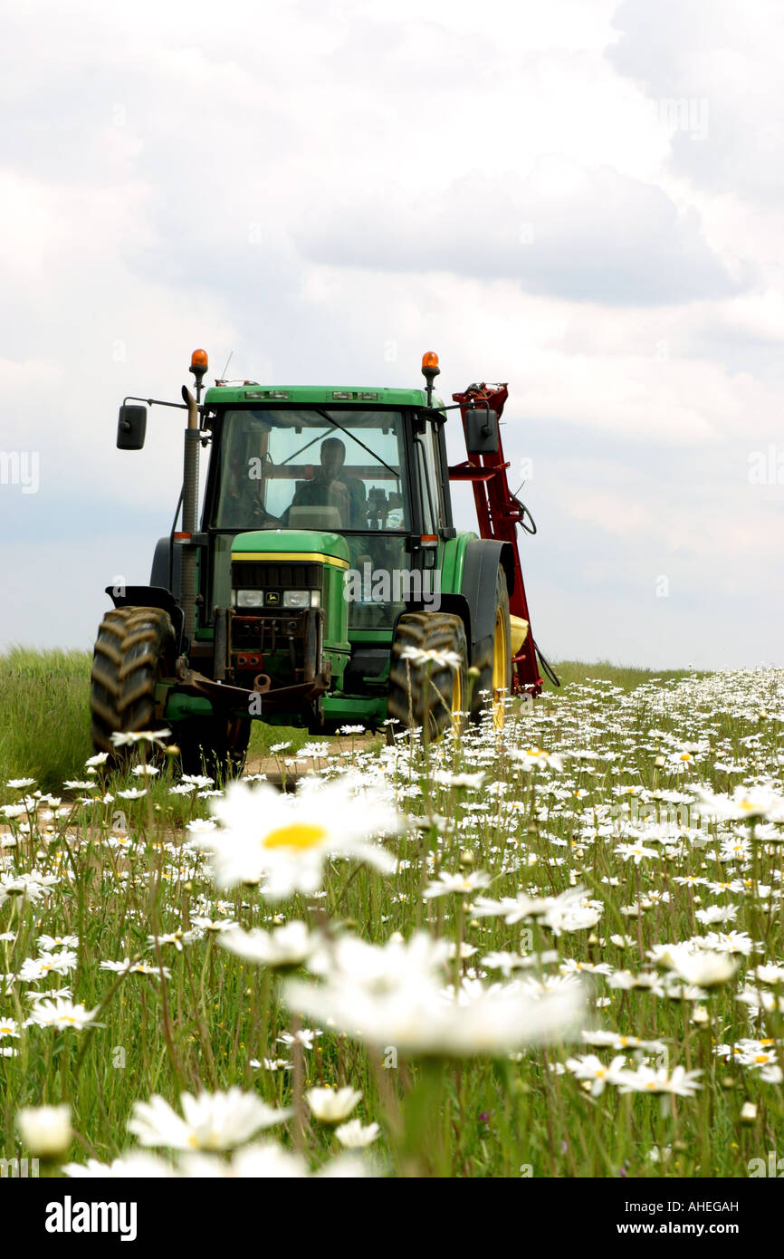 Tractor driving next to a ELS border Stock Photo - Alamy