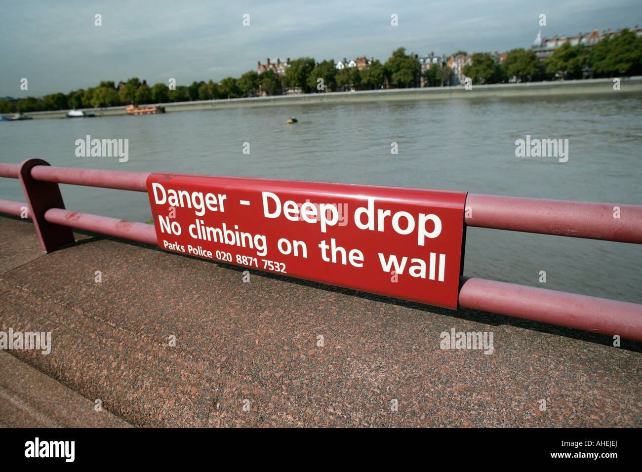 Warning sign by the River Thames banks, Battersea Park, London, England ...