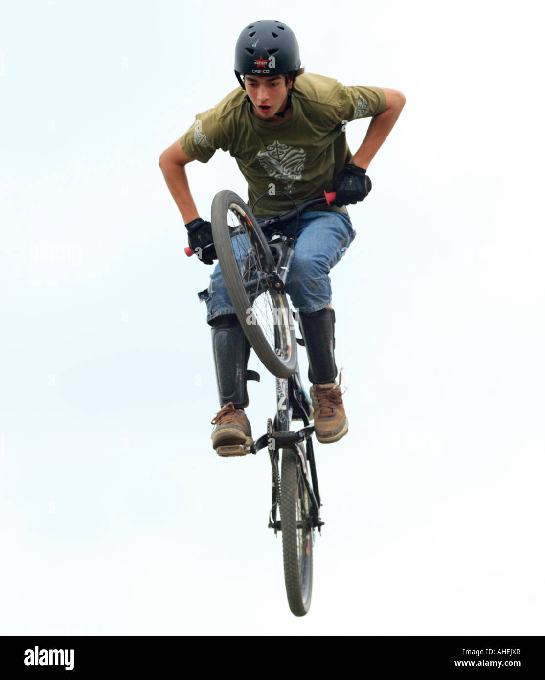 young boy jumping with his bike Stock Photo - Alamy