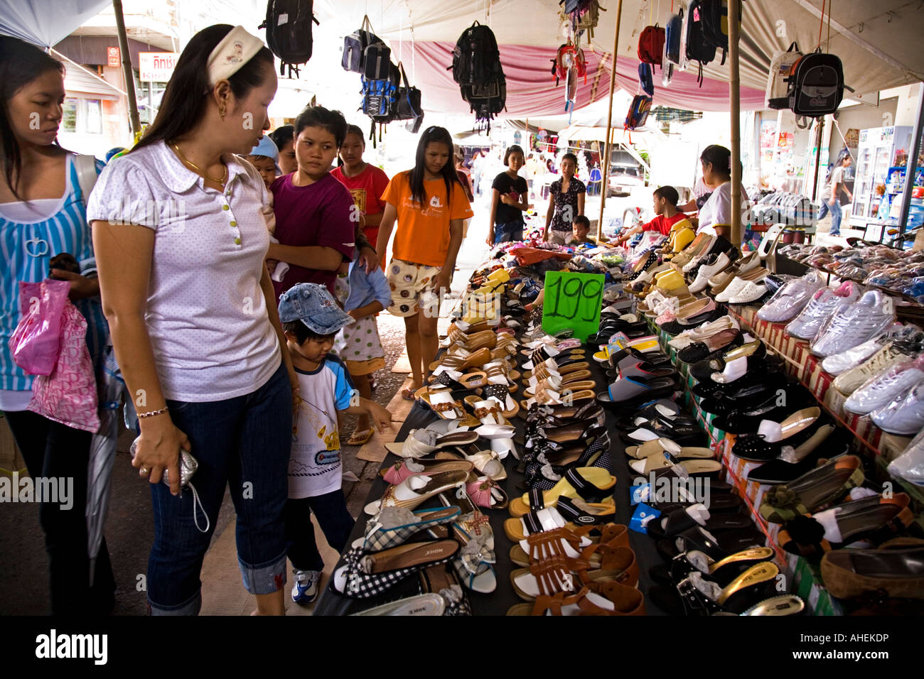 Street stall seller vendor selling foot wear and bags in Banchang ...