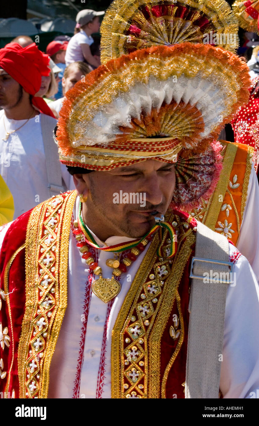 indian man wearing traditional head dress in carnival Stock Photo - Alamy