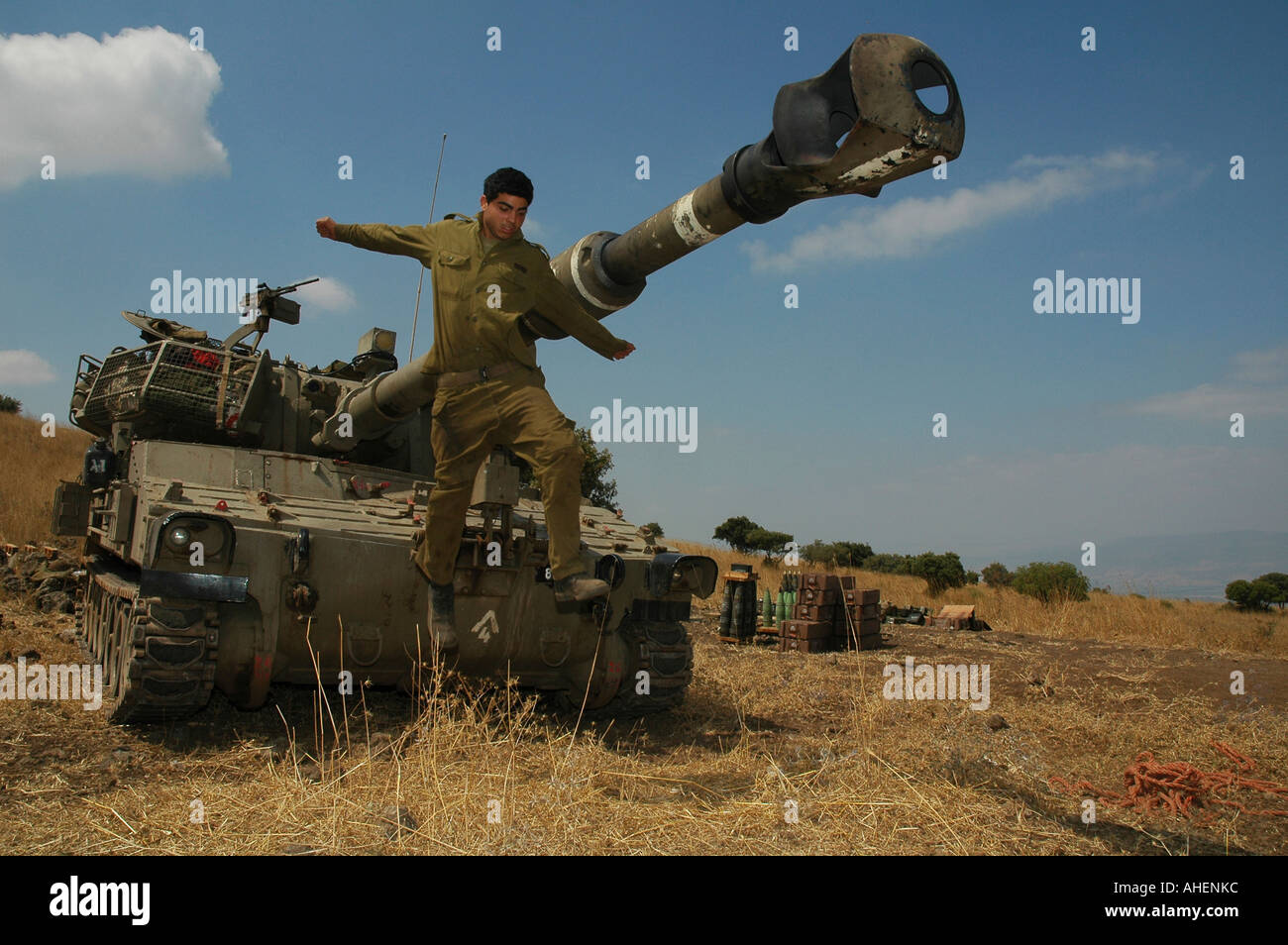 An Israeli soldier jumping from a M109 self-propelled howitzer in the ...