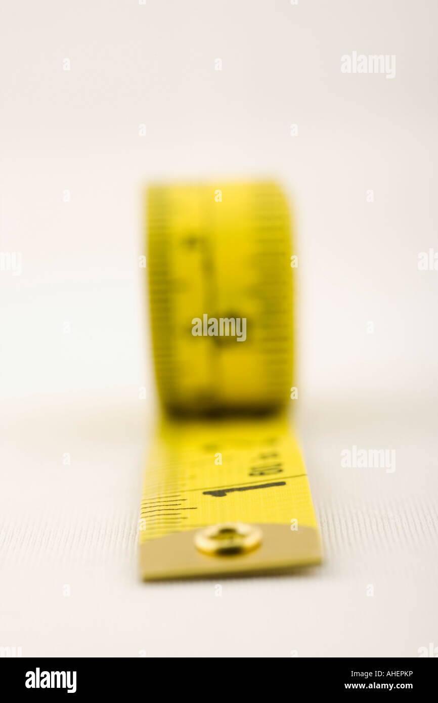 Yellow tape measure Stock Photo - Alamy