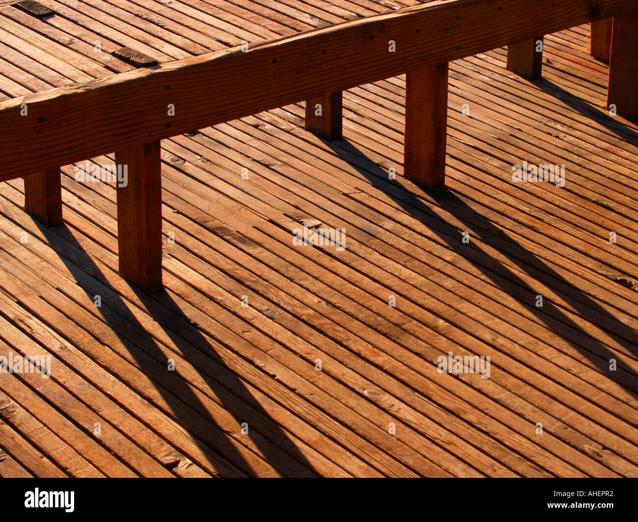 Long wooden bench rising from a long-planked wooden floor in the ...