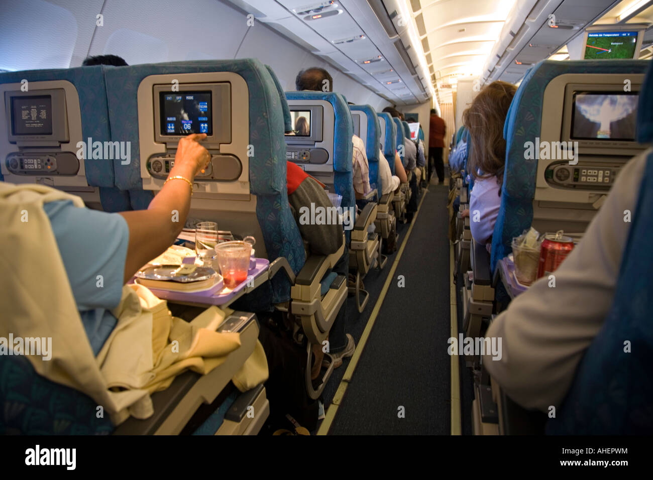 Interior cabin and aisle of a passenger jet plane / airplane ...