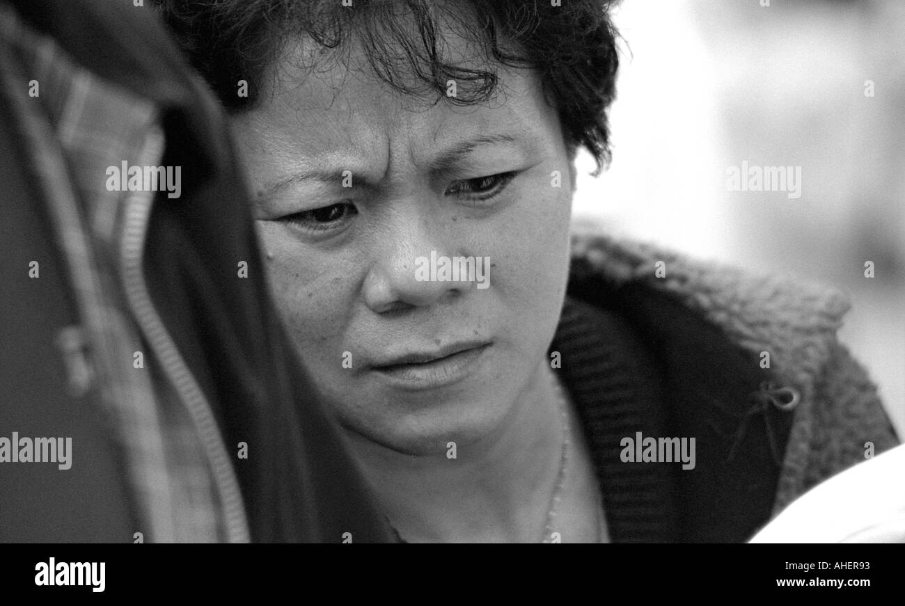 Lady resting head on mans chest and looking sad and upset Stock Photo ...