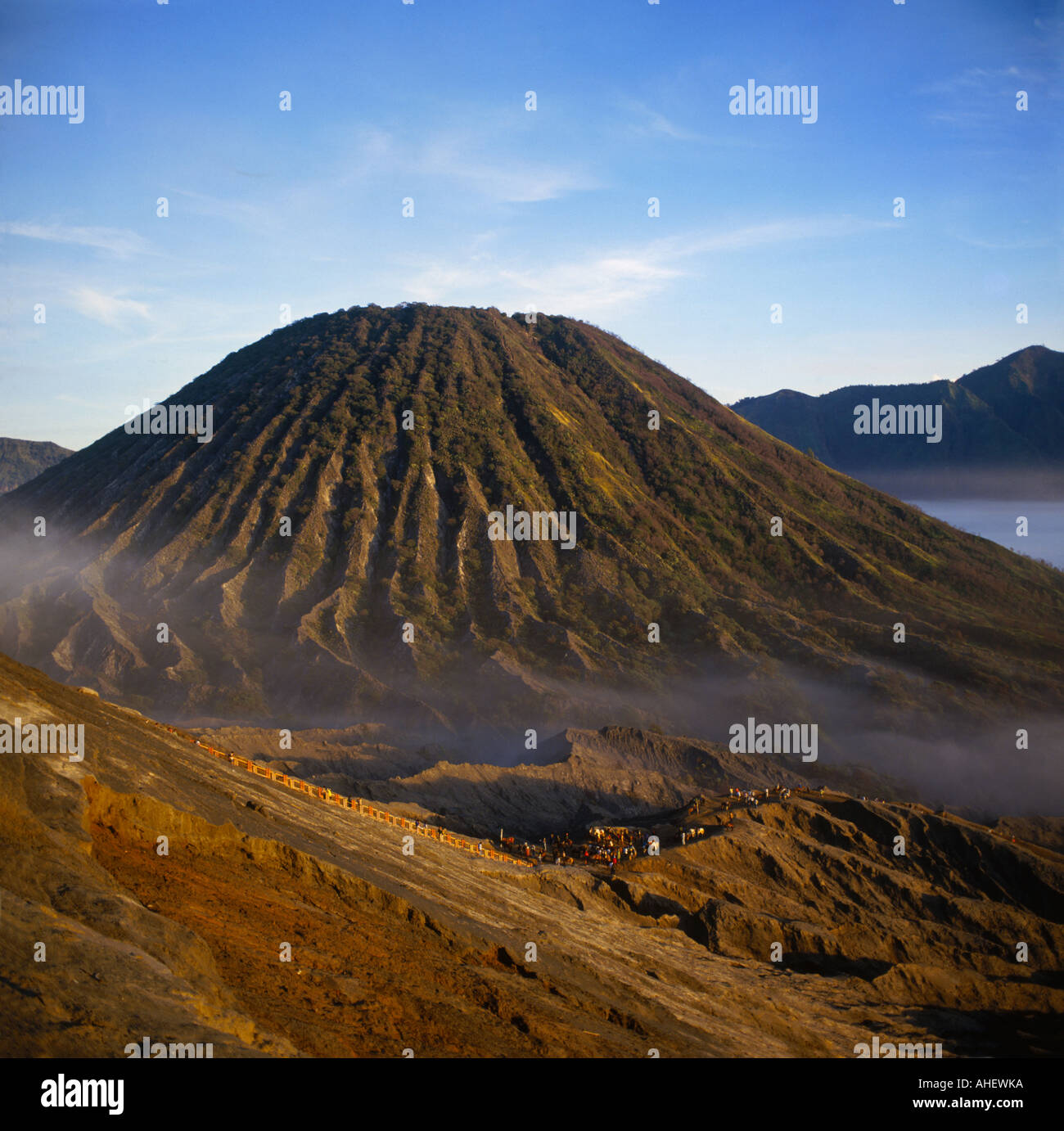 Mount Batok volcano viewed over dry barren lava towards the cone-shaped ...