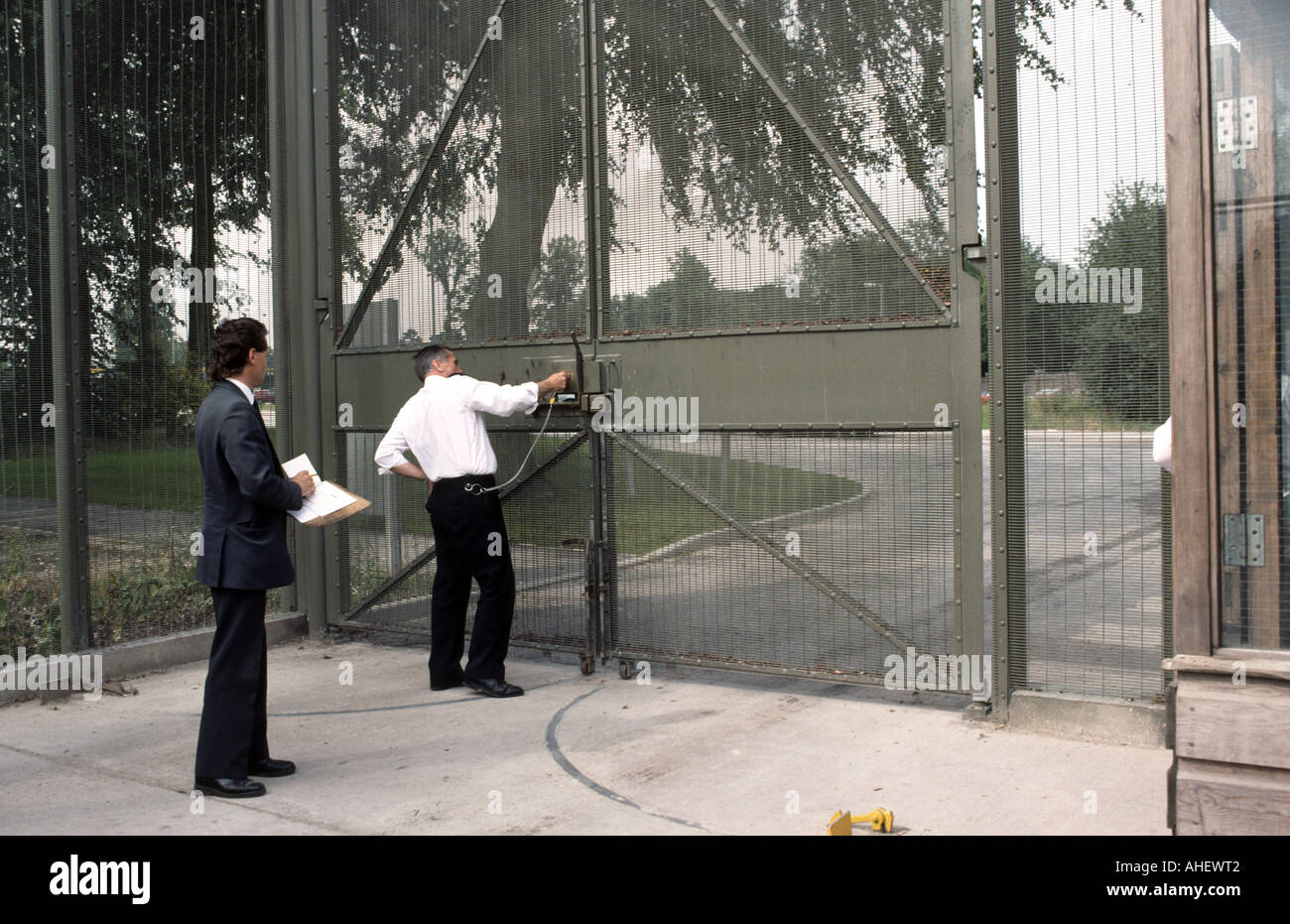 prison guard opening prison gate Stock Photo - Alamy