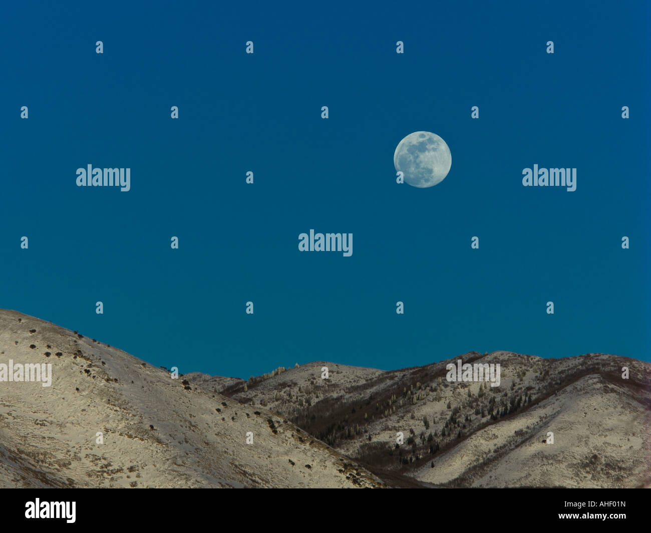 Full moon over snow capped hi-res stock photography and images - Alamy