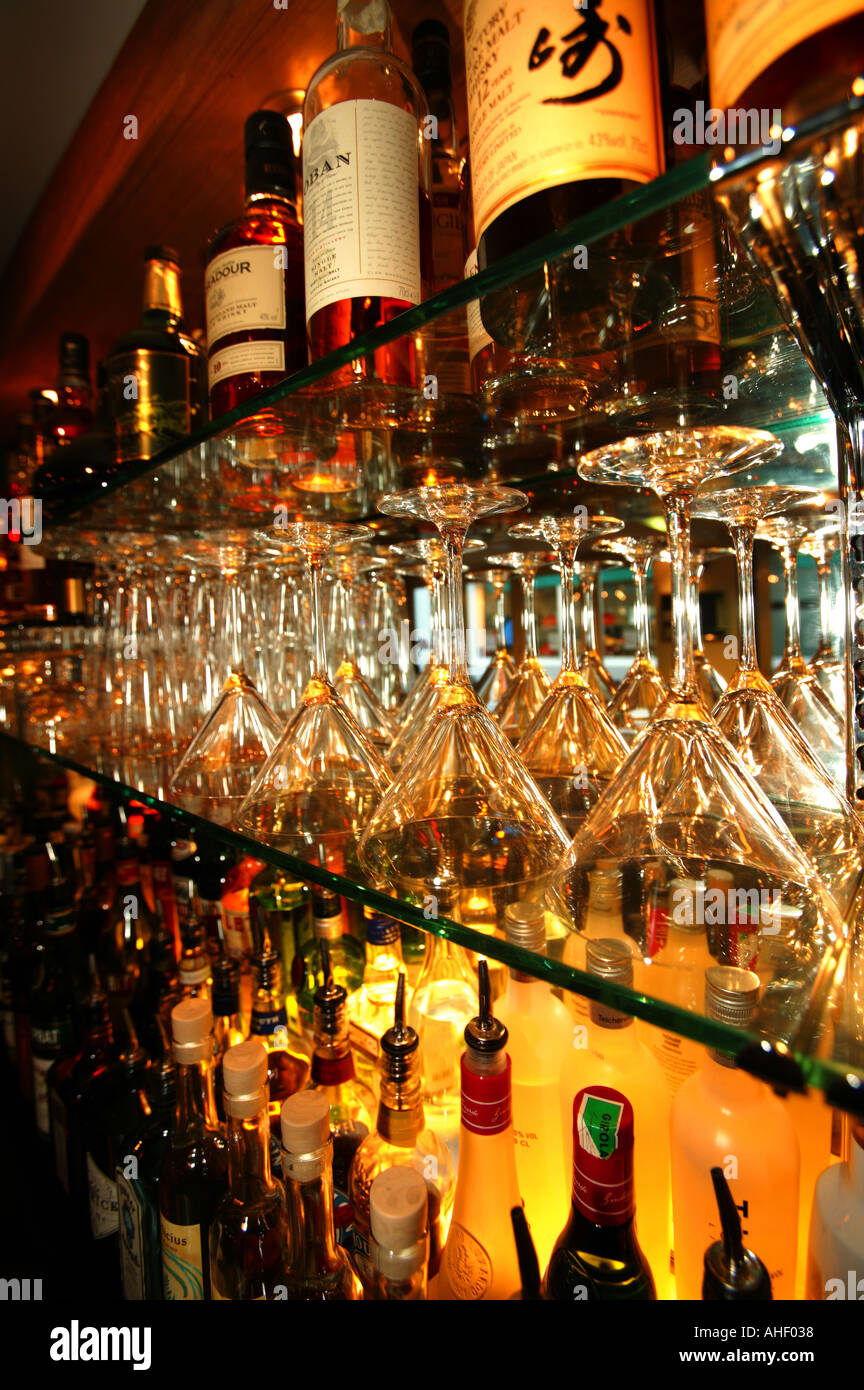 cocktail bottles behind a bar of a club Stock Photo - Alamy