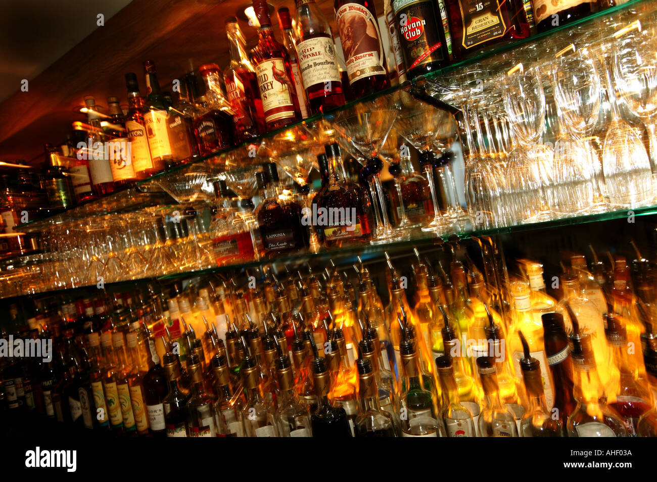 cocktail bottles behind a bar of a club Stock Photo - Alamy