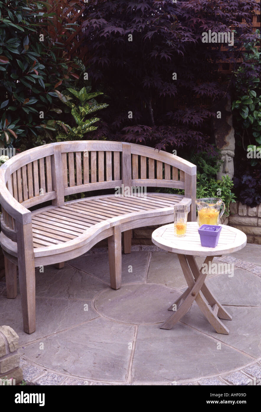 The Enchanted Garden Central water feature with seating area Stock ...