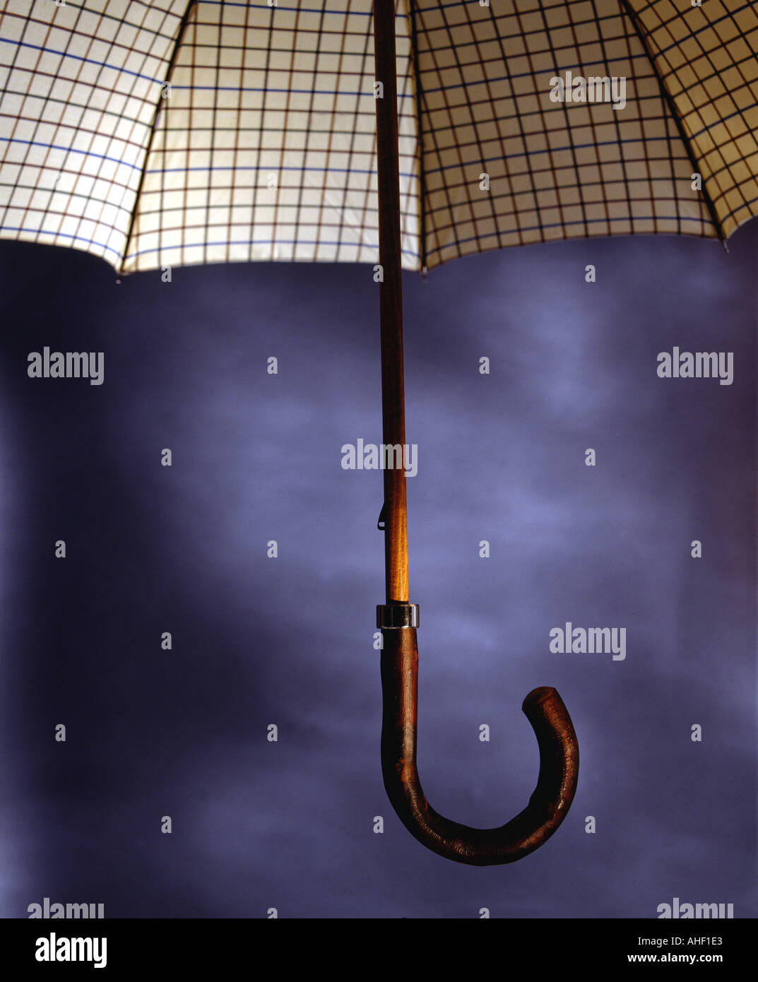 Open umbrella against a stormy background Stock Photo - Alamy
