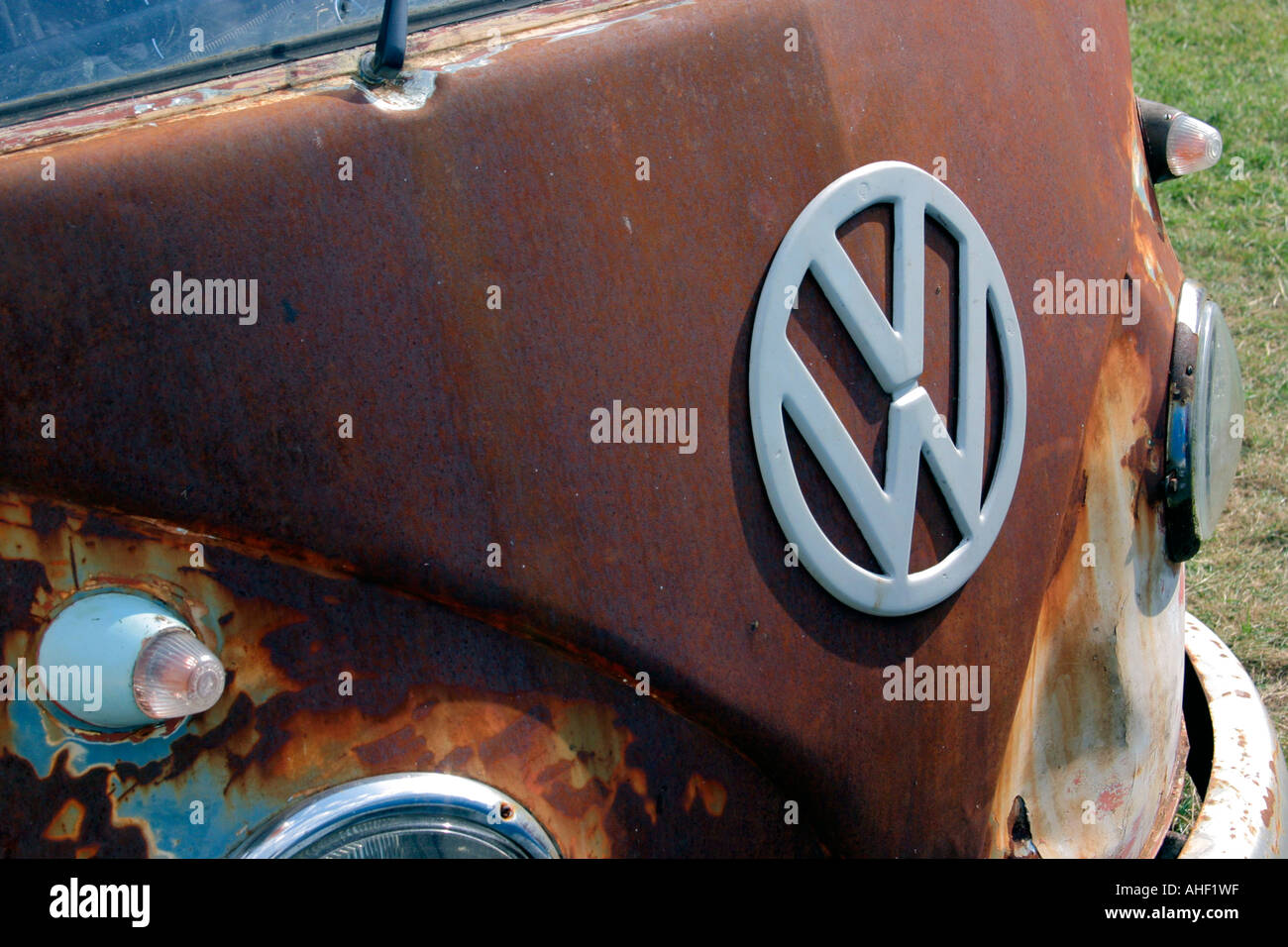 Old rusty VW campervan detail of logo on front Stock Photo - Alamy