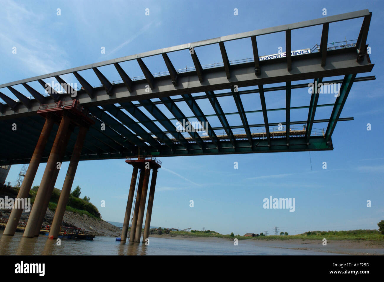 Road bridge under construction over the River Usk being winched into ...