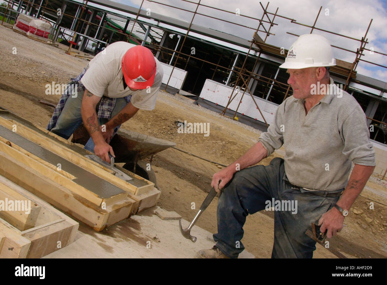 Builders on construction site in UK Stock Photo - Alamy