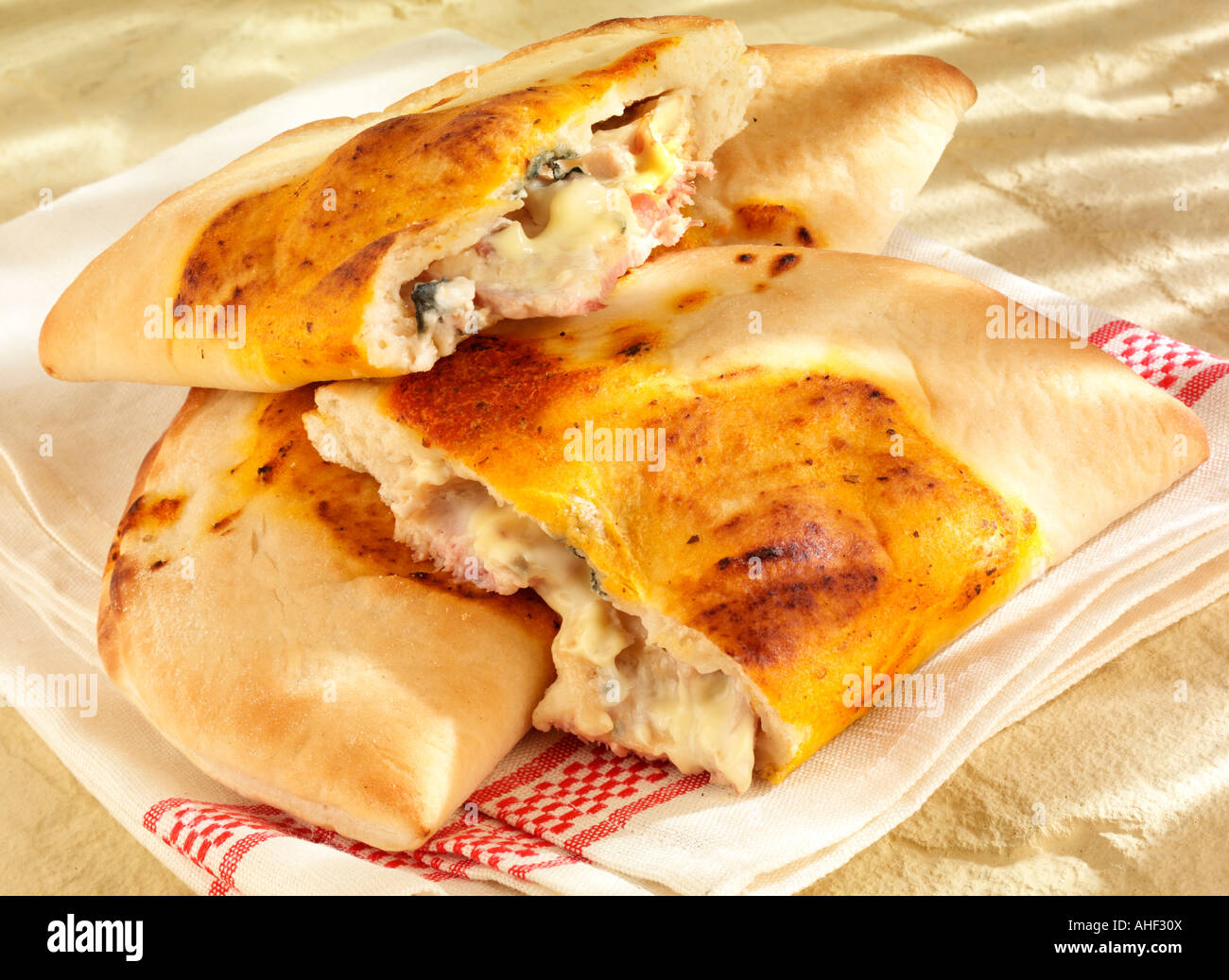 ITALIAN HAM AND CHEESE CALZONE Stock Photo - Alamy
