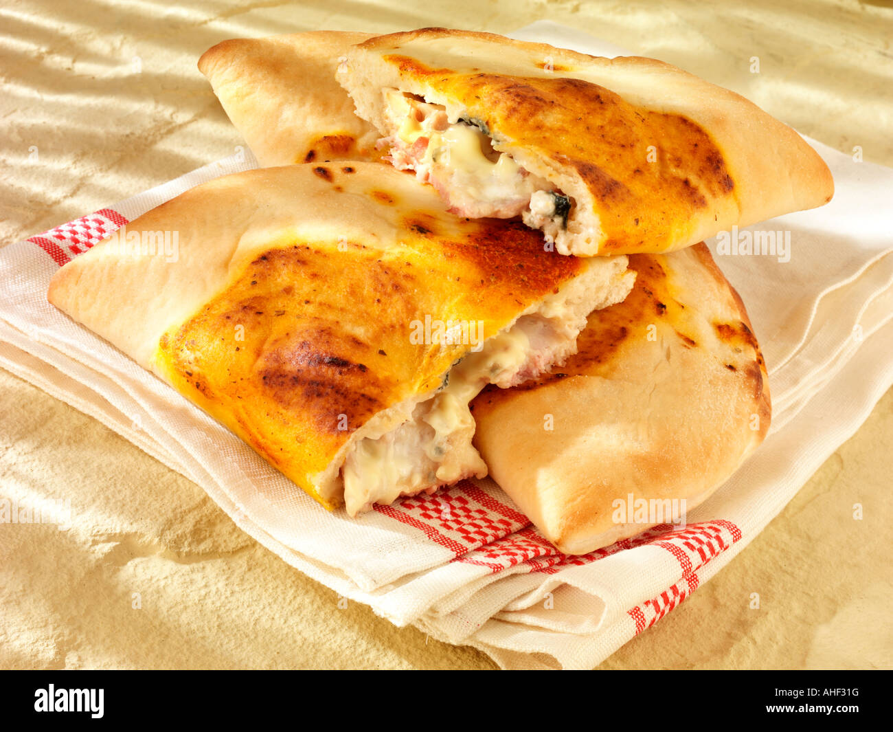 ITALIAN HAM AND CHEESE CALZONE Stock Photo - Alamy