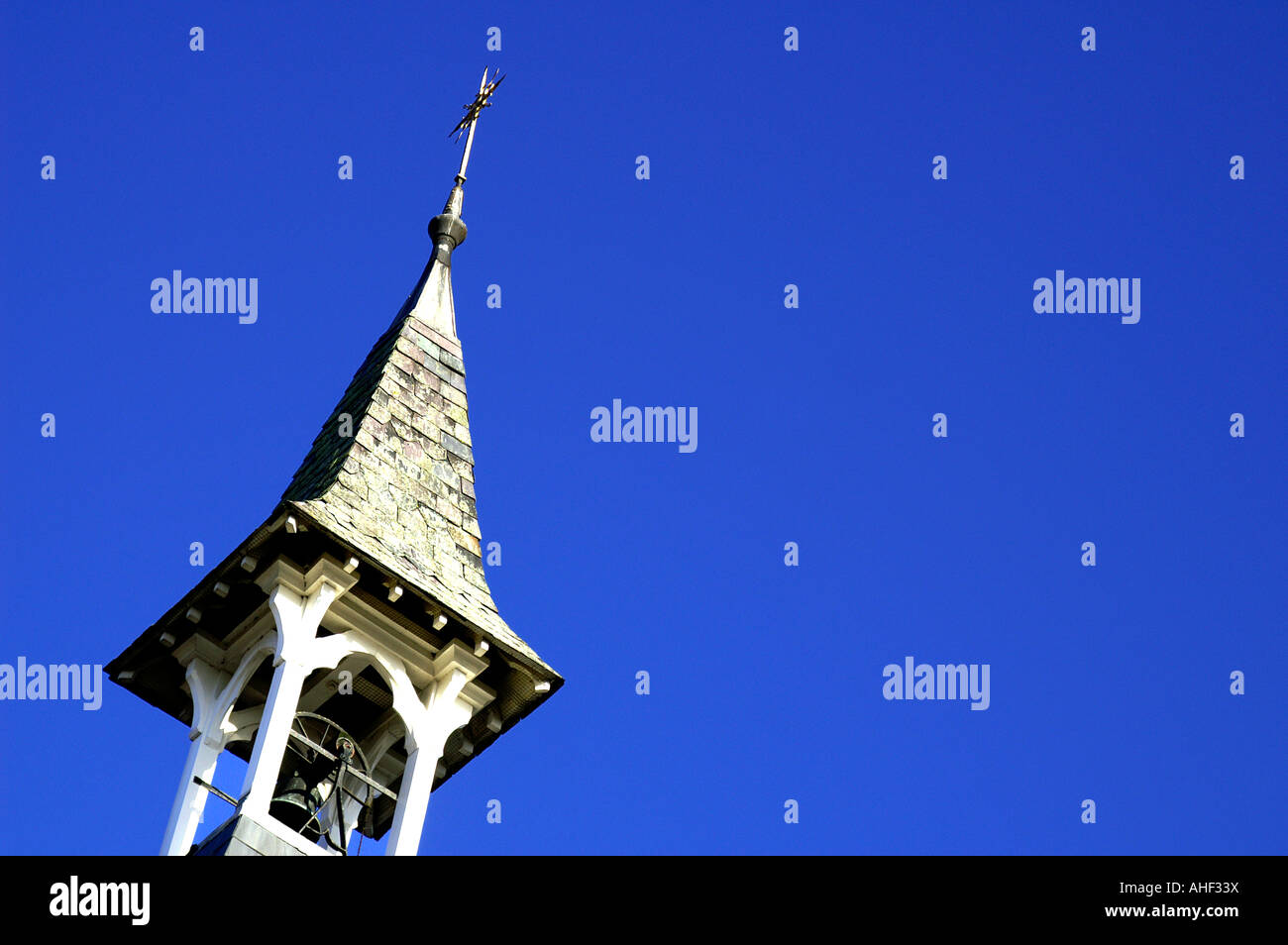 pointed spire with bell in Warwick Stock Photo - Alamy
