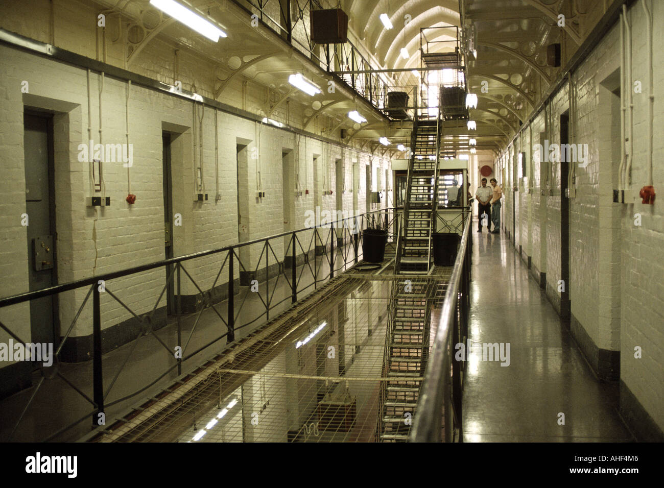 Interior of a prison with guards and prisoners Stock Photo - Alamy
