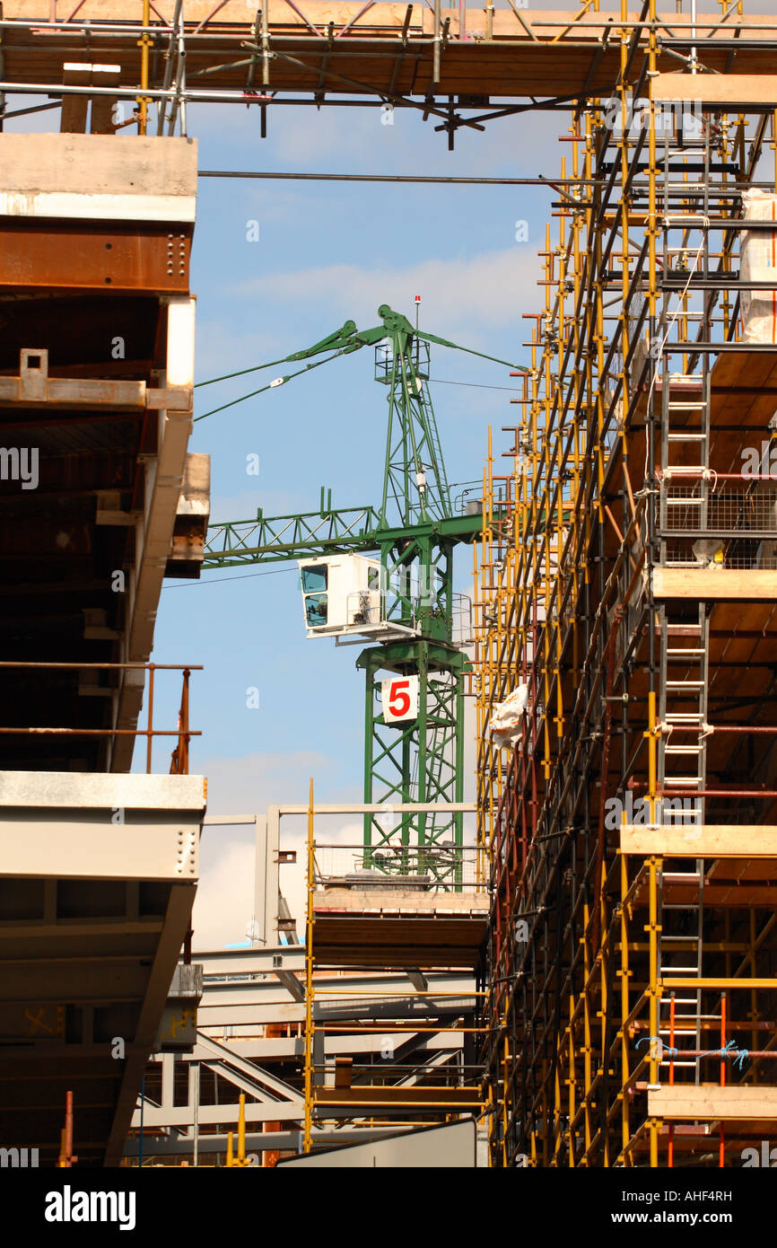 Building construction site with crane and scaffolding Stock Photo - Alamy