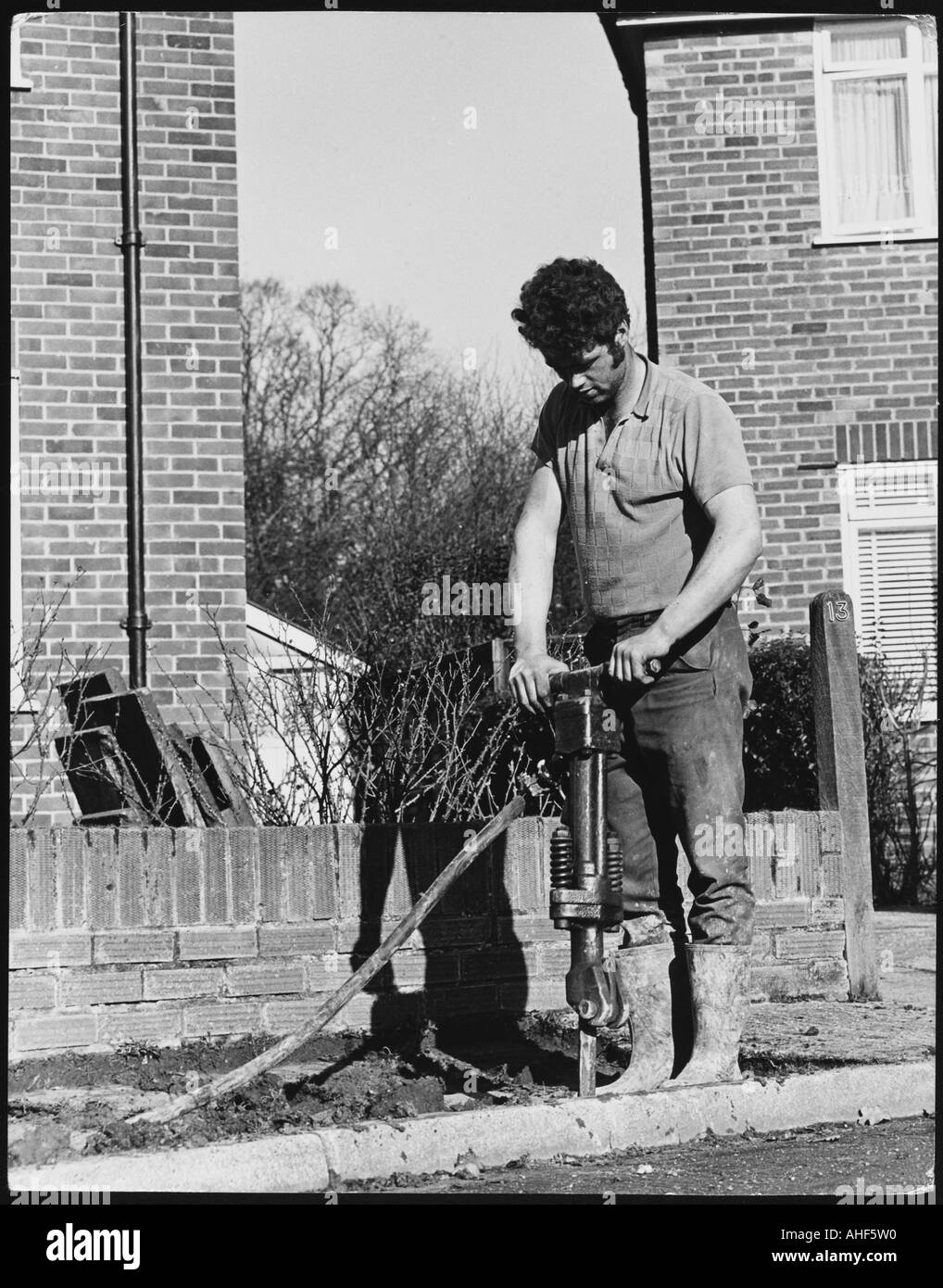 Man using old drill hi-res stock photography and images - Alamy