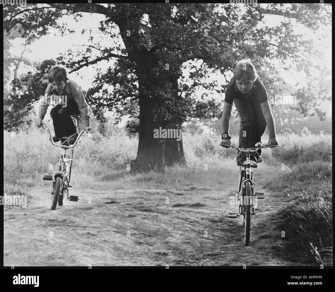 Two boys riding bikes hi-res stock photography and images - Alamy