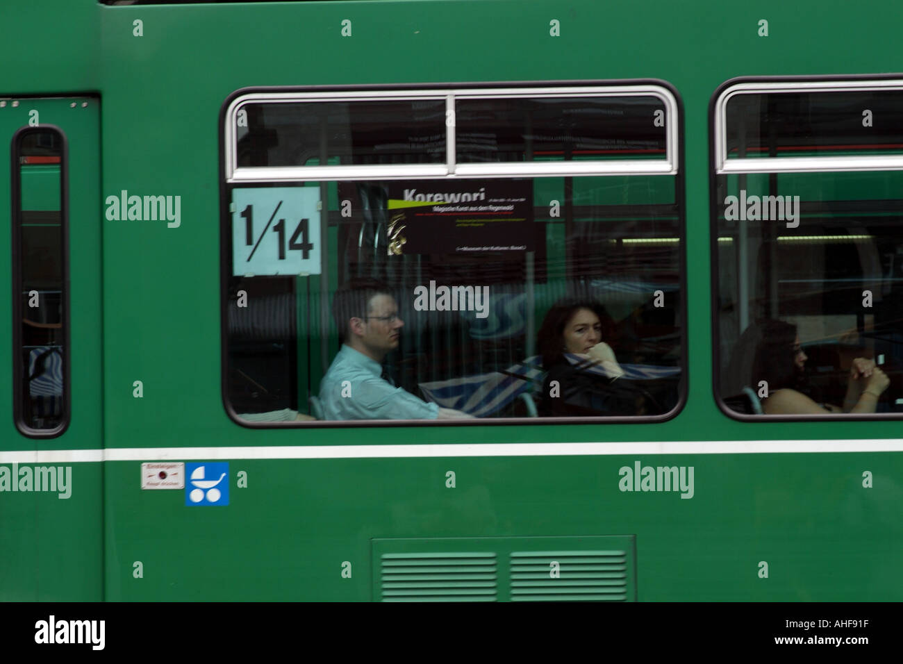 People riding trolly Stock Photo - Alamy