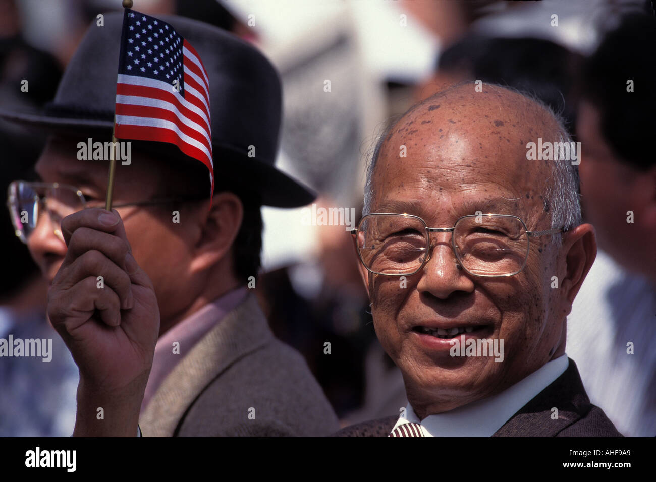 Hong Kong Chinese Immigrant Waves US Flag During US Naturalization ...