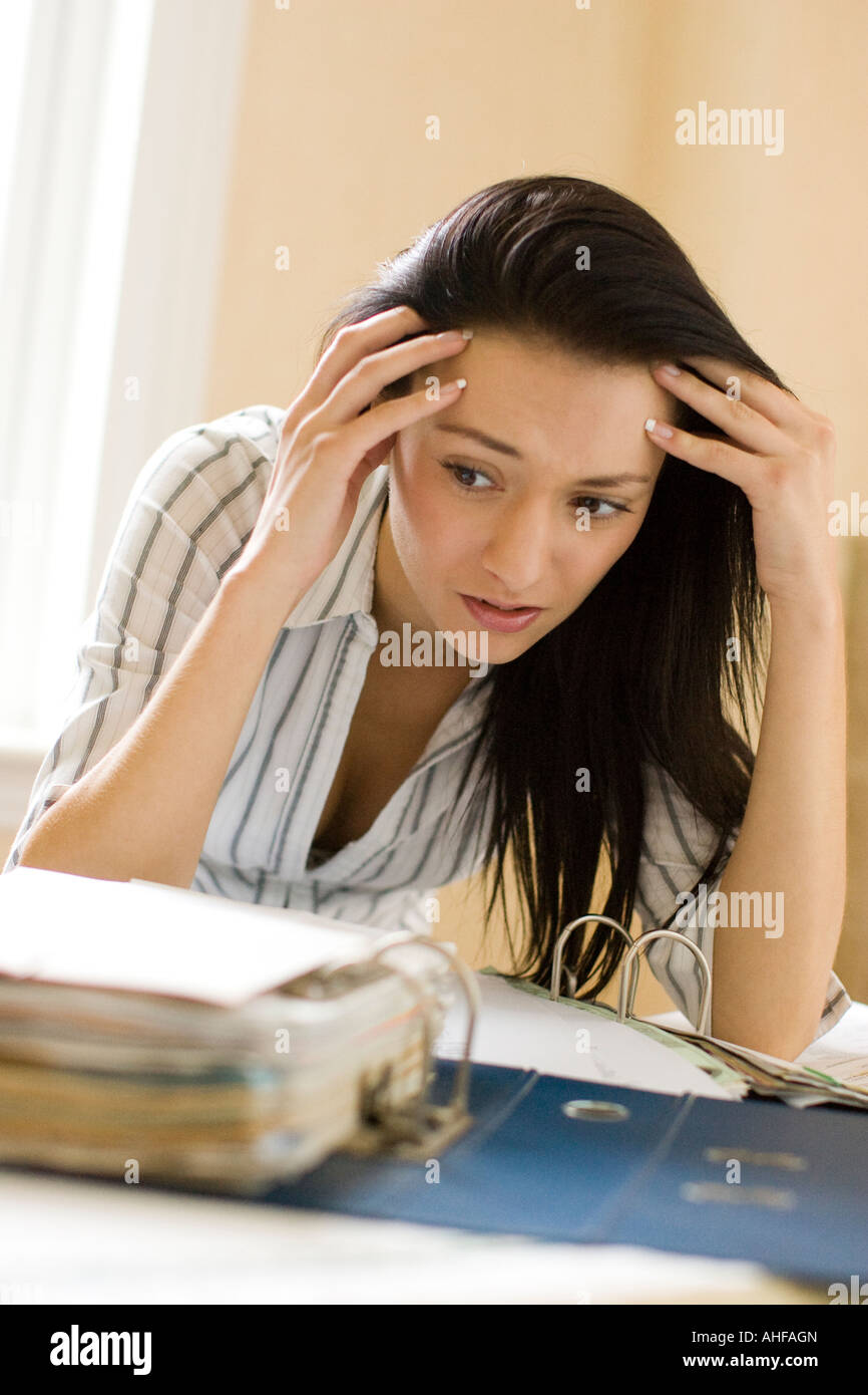 Stressed girl at work Stock Photo - Alamy