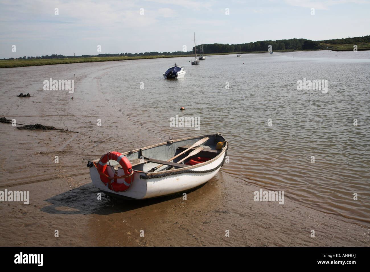 Small dingy boat in mud butley creek hi-res stock photography and ...