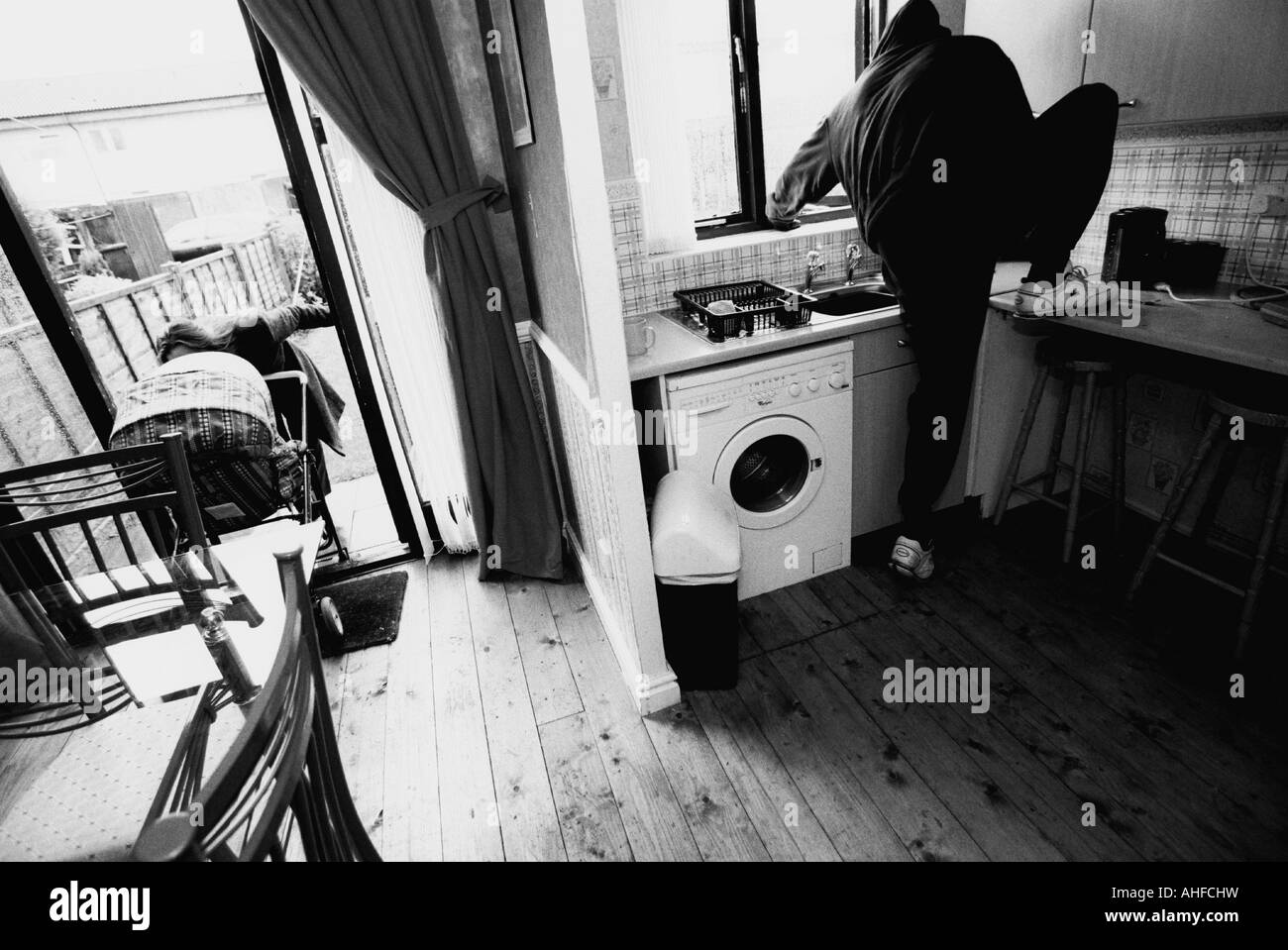 House robbery Black and White Stock Photos & Images - Alamy