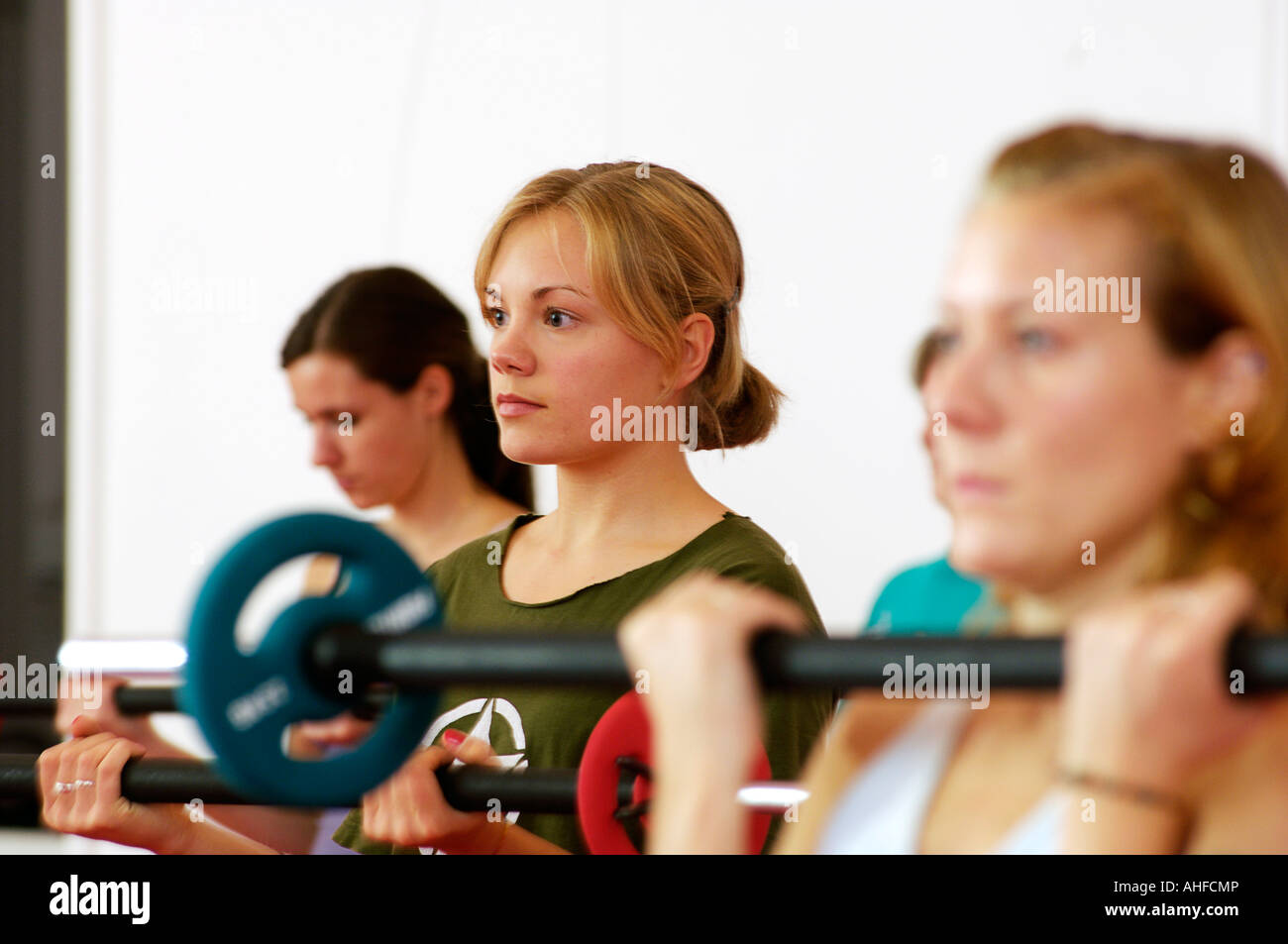 Woman training with weights Stock Photo - Alamy