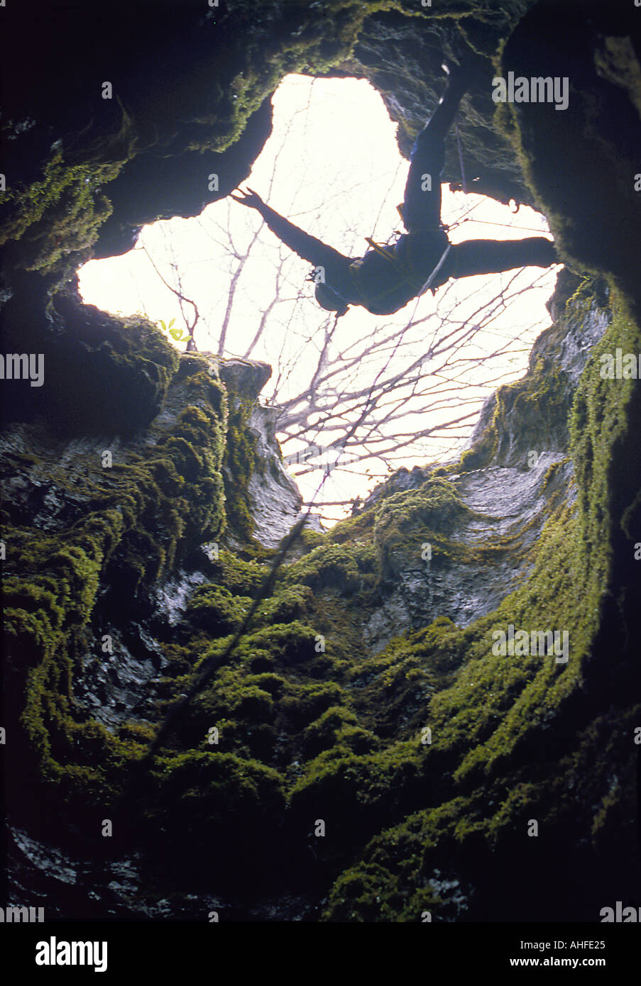 A cave explorer descending down the crevice Manjaca mountain Bosnia ...