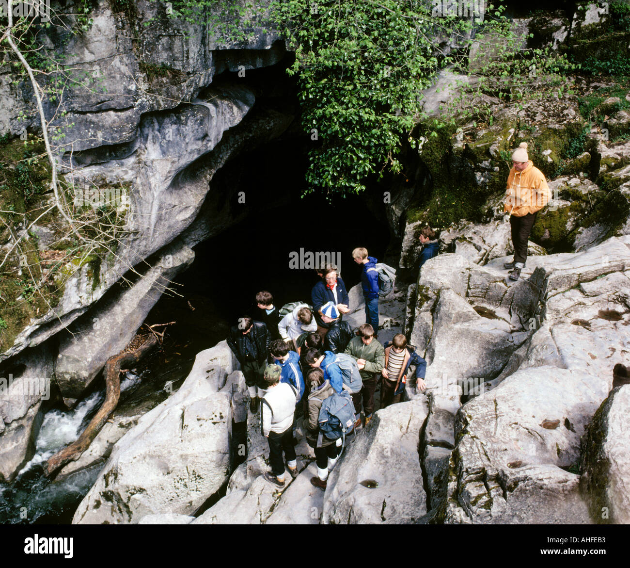 Group at resurgence pool Porth yr Ogof South Wales Stock Photo - Alamy