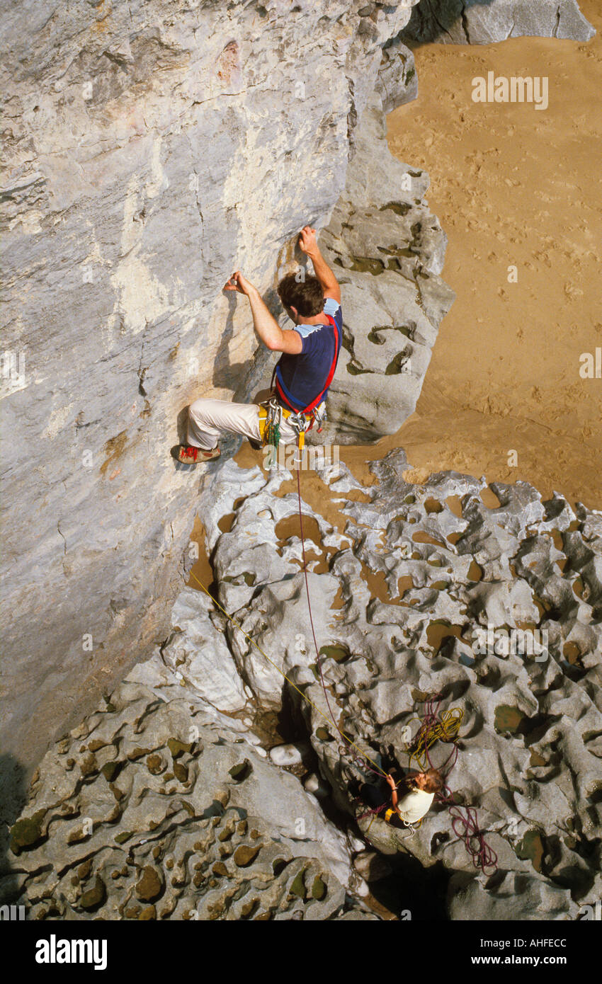 Pat Littlejohn climbing Masterpiece on the Gower sea cliffs in South ...
