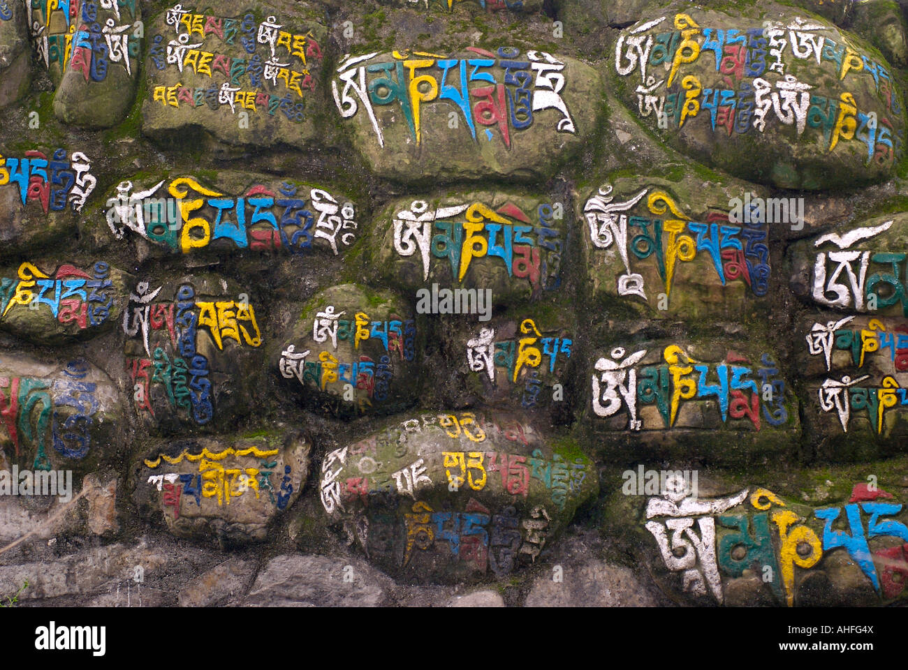Sanskrit writing on stone wall hi-res stock photography and images - Alamy