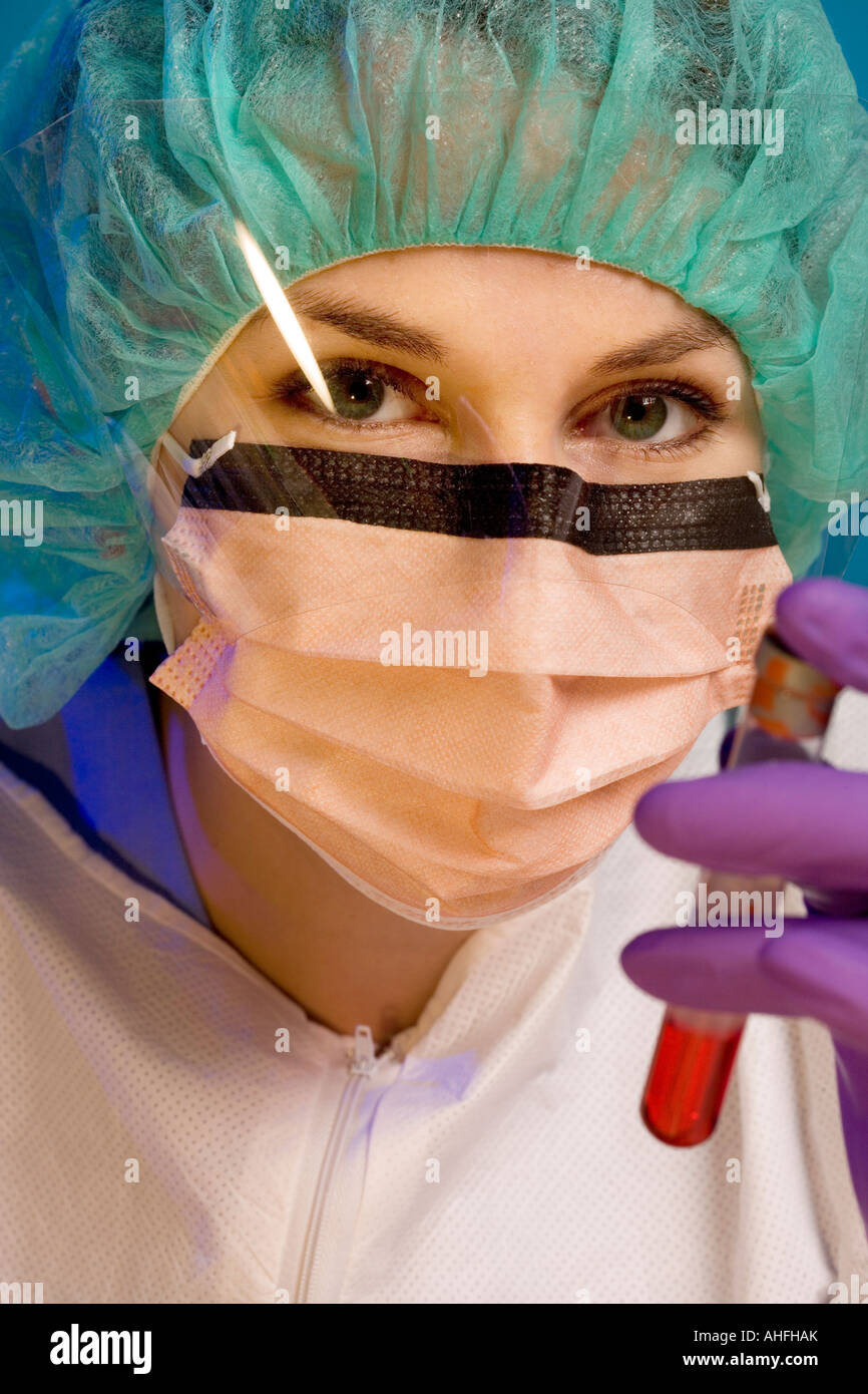 Female lab tech holding single test tube specimen in gloved hand Stock ...