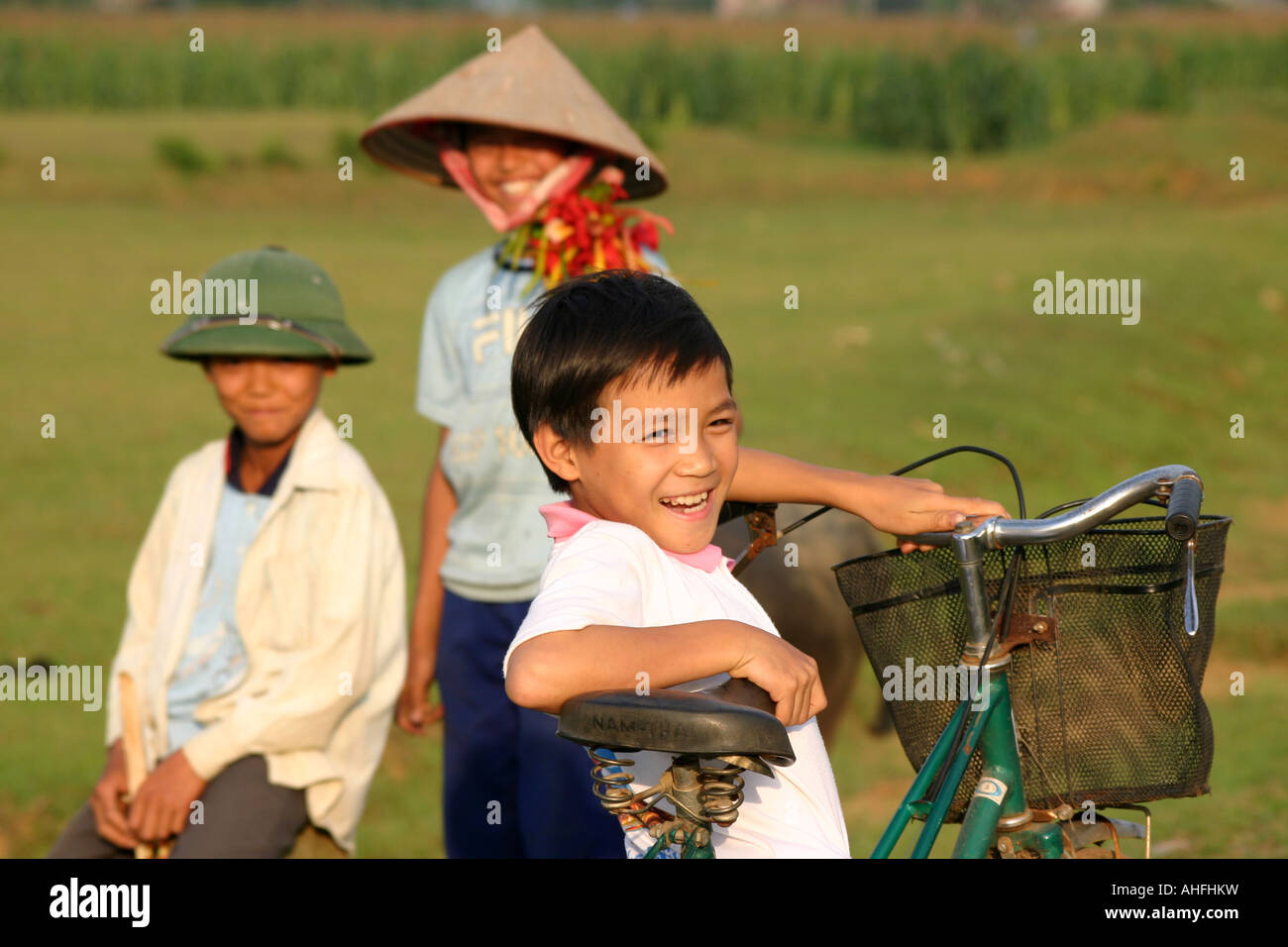Three Vietnamese children smiling Stock Photo - Alamy