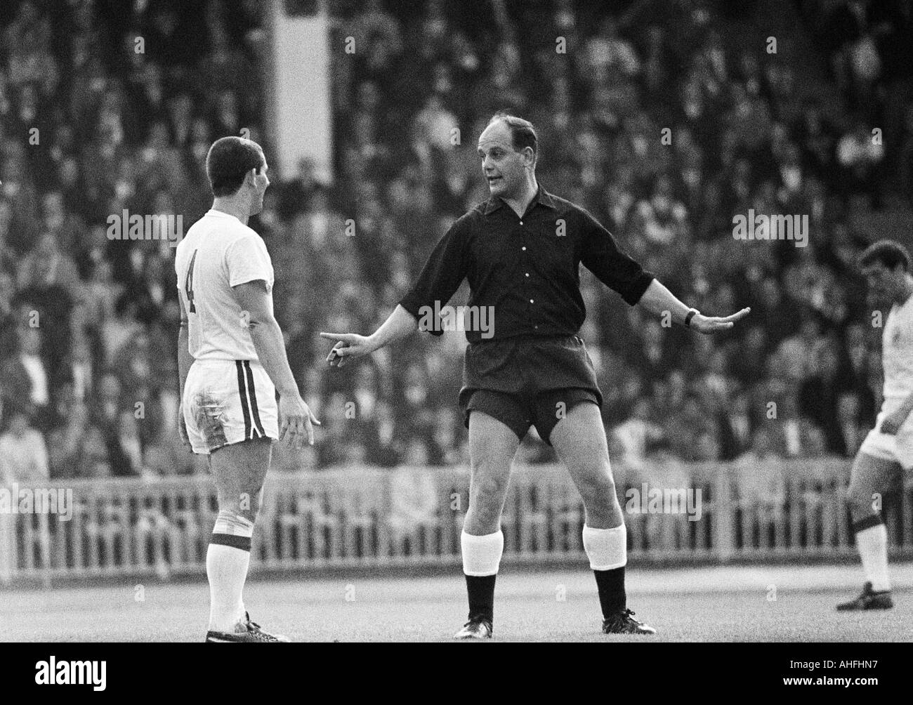 Football referee talking player Black and White Stock Photos & Images ...