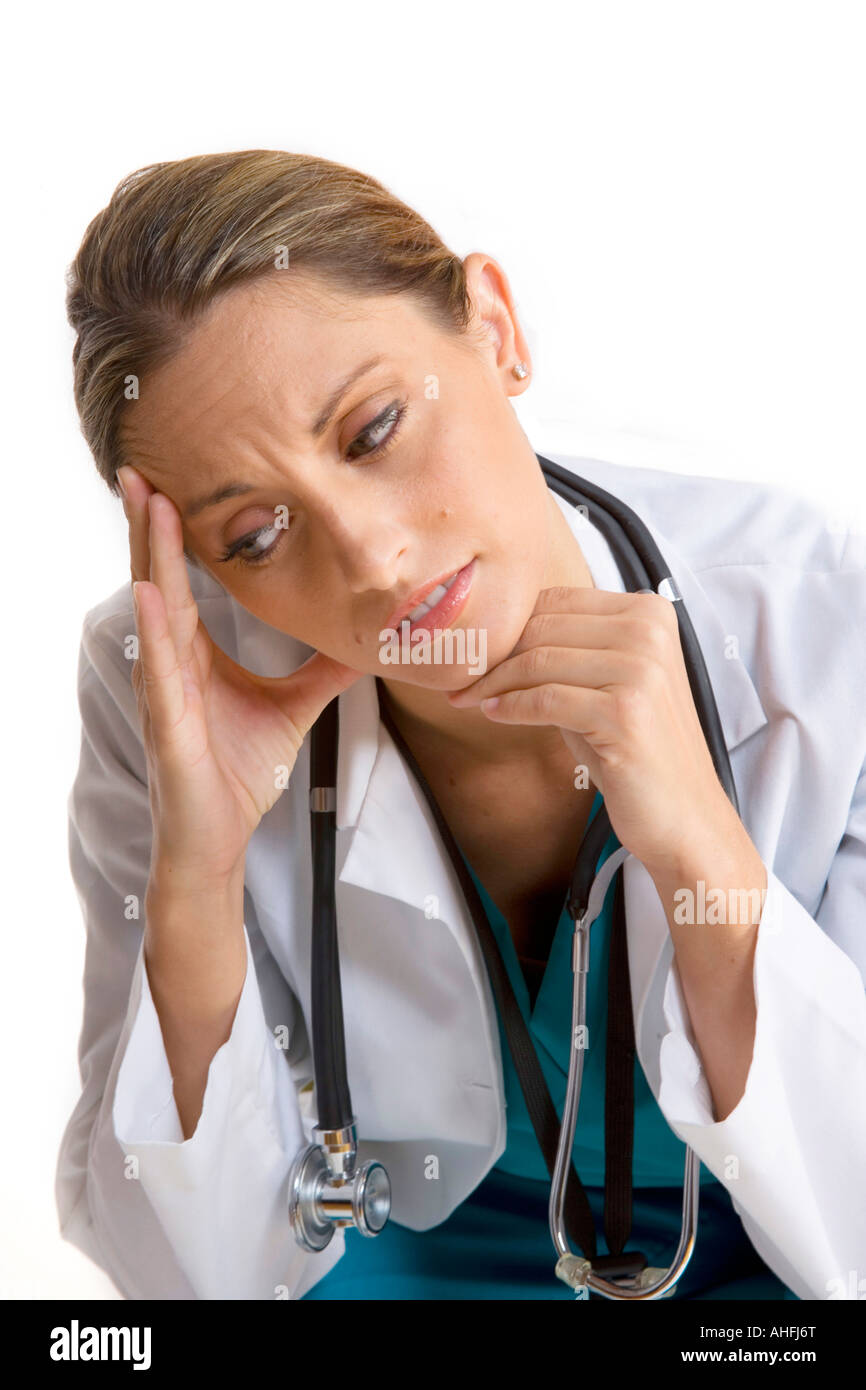 Stressed out, over worked female doctor Stock Photo - Alamy