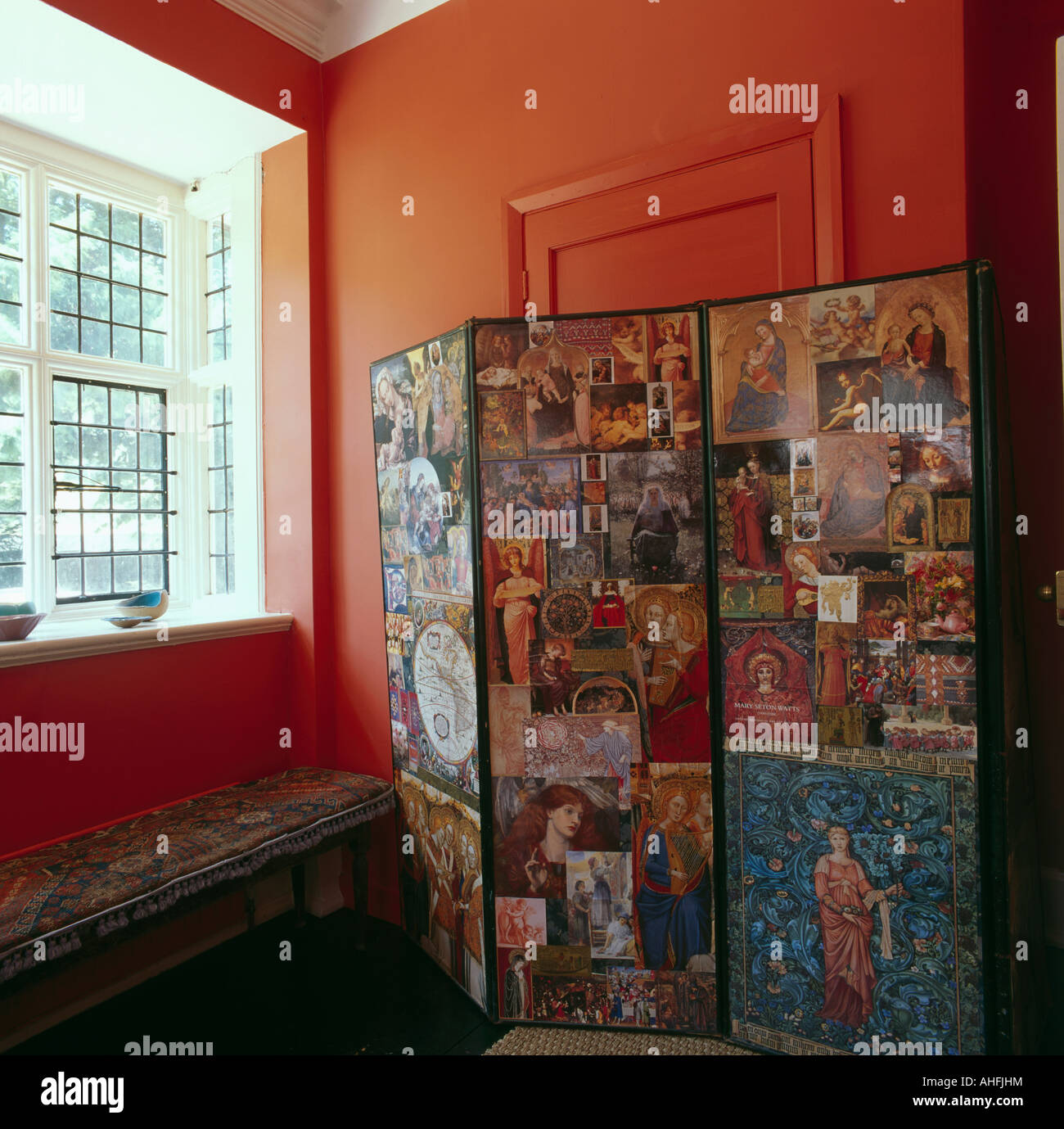 Decoupage folding screen in red room Stock Photo - Alamy